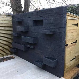 Millboard feature wall with built in shed - Wimbledon - All on deck